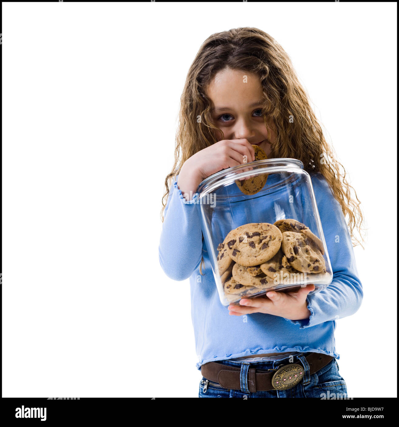 Girl eating cookies Stock Photo - Alamy