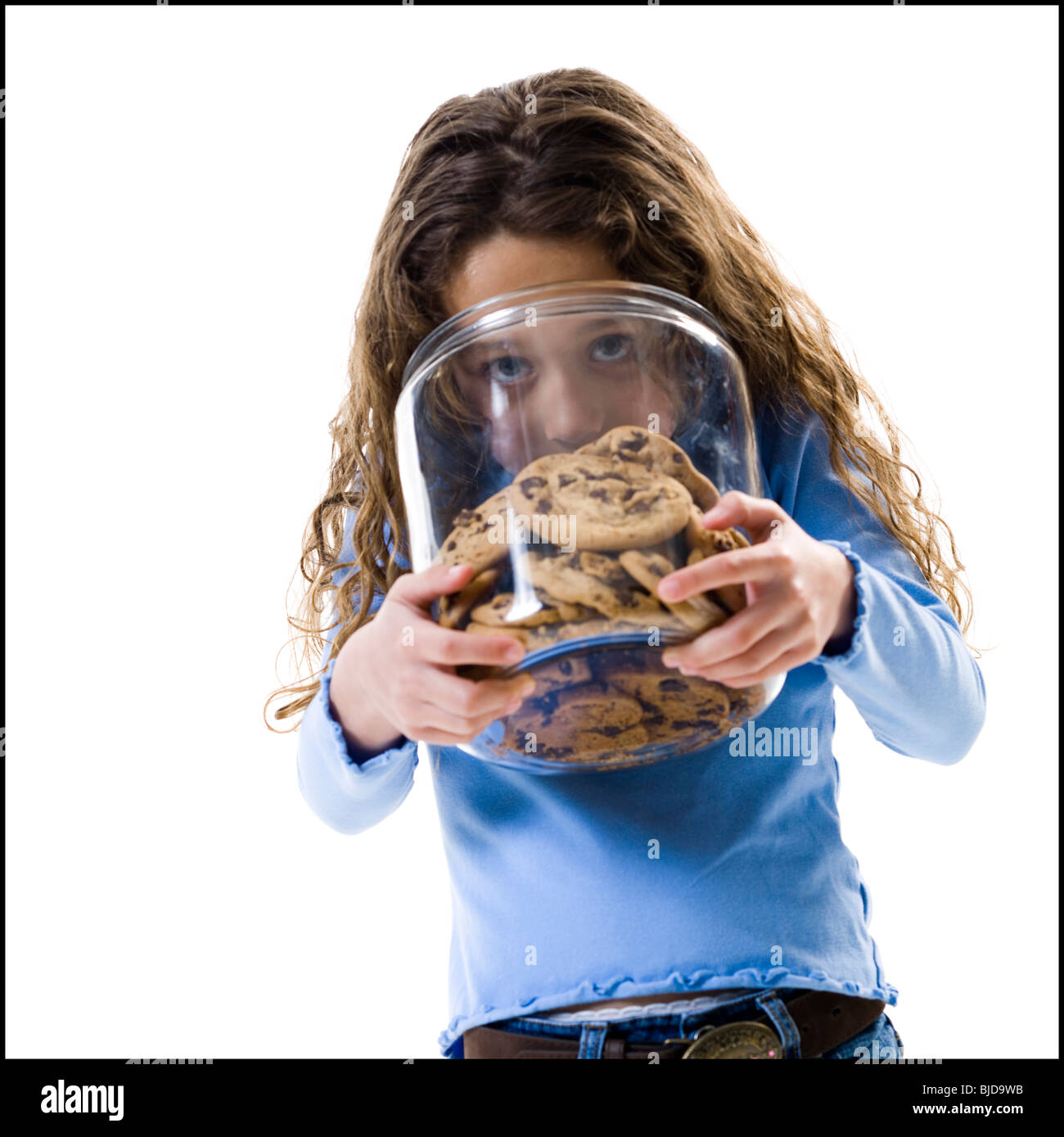 Girl eating cookies Stock Photo - Alamy
