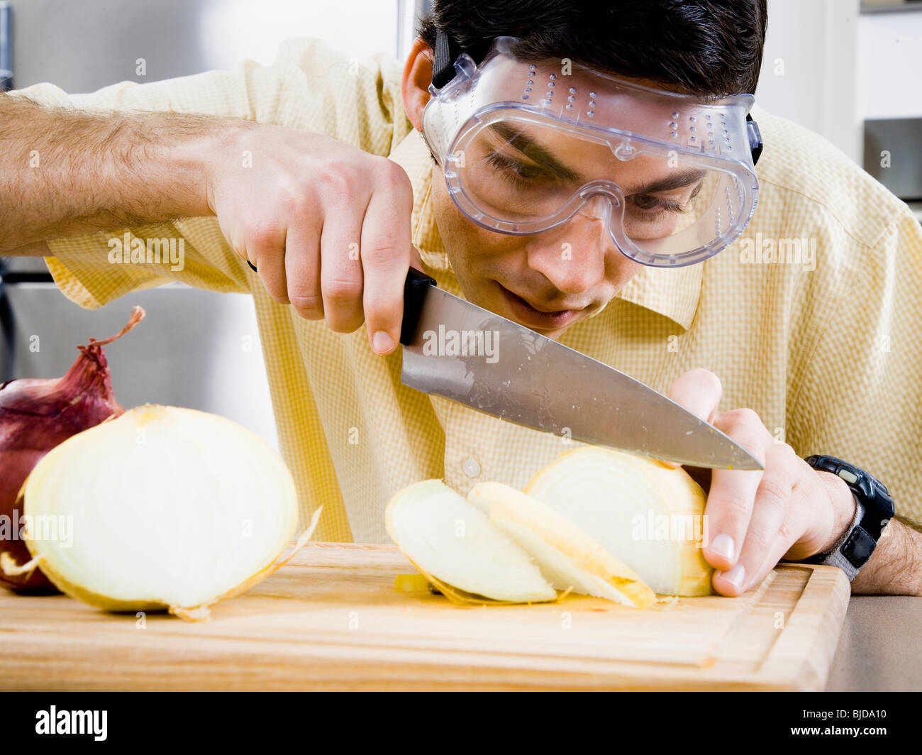 Man cutting onions hi-res stock photography and images - Alamy