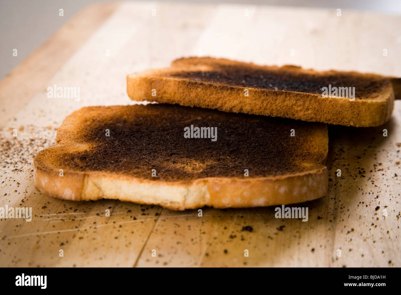woman scraping toast Stock Photo - Alamy