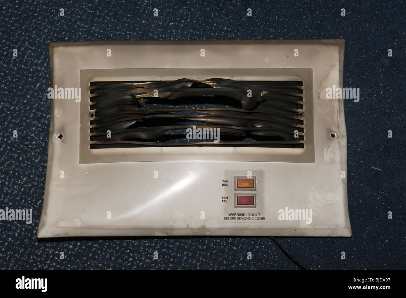Burnt out air conditioning fan following fire in unit Stock Photo - Alamy