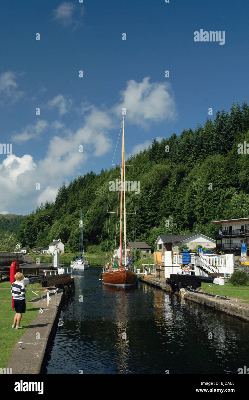 A yacht passing through the locks at Cairnbaan on the Crinan Canal ...
