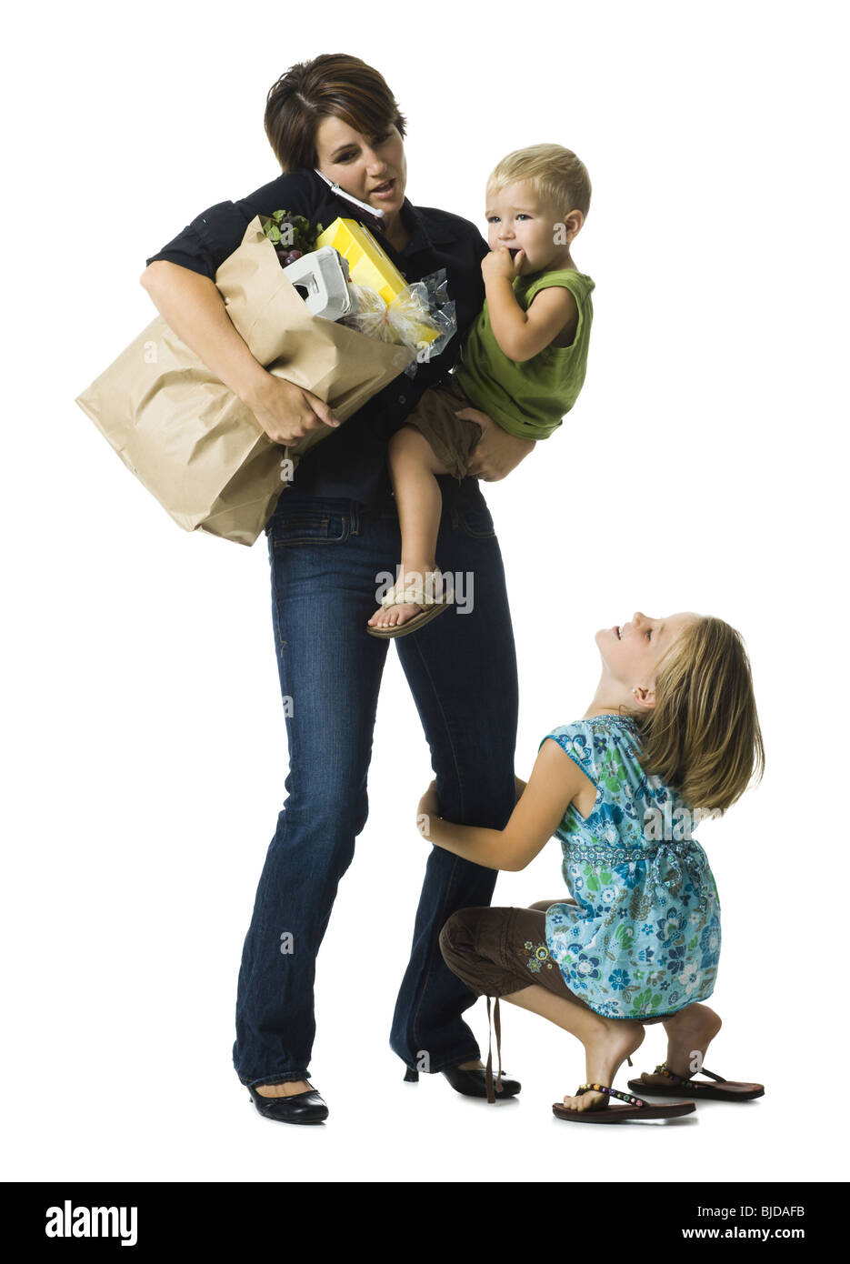 Busy Mom with baby and small child Stock Photo - Alamy