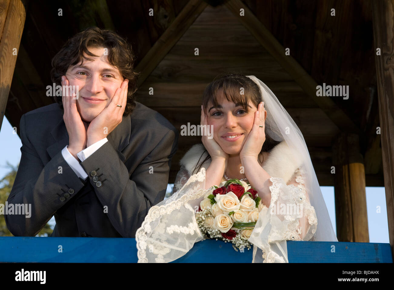 Happy just married couple making a bug smile face Stock Photo - Alamy