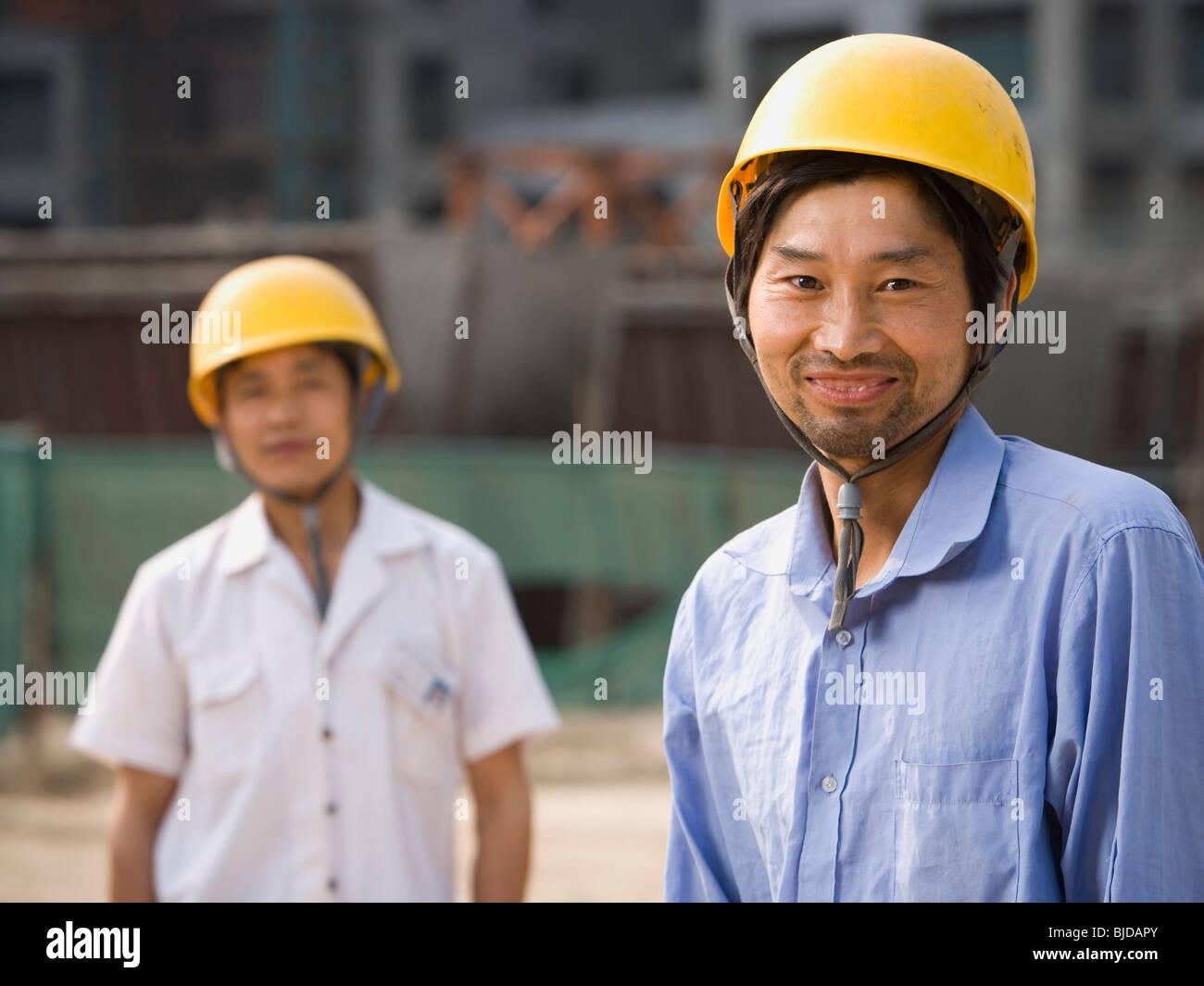 Two construction workers on the job site Stock Photo - Alamy
