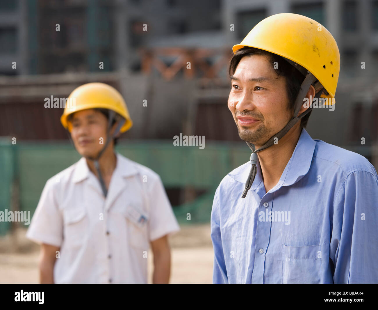 Two construction workers on the job site Stock Photo - Alamy