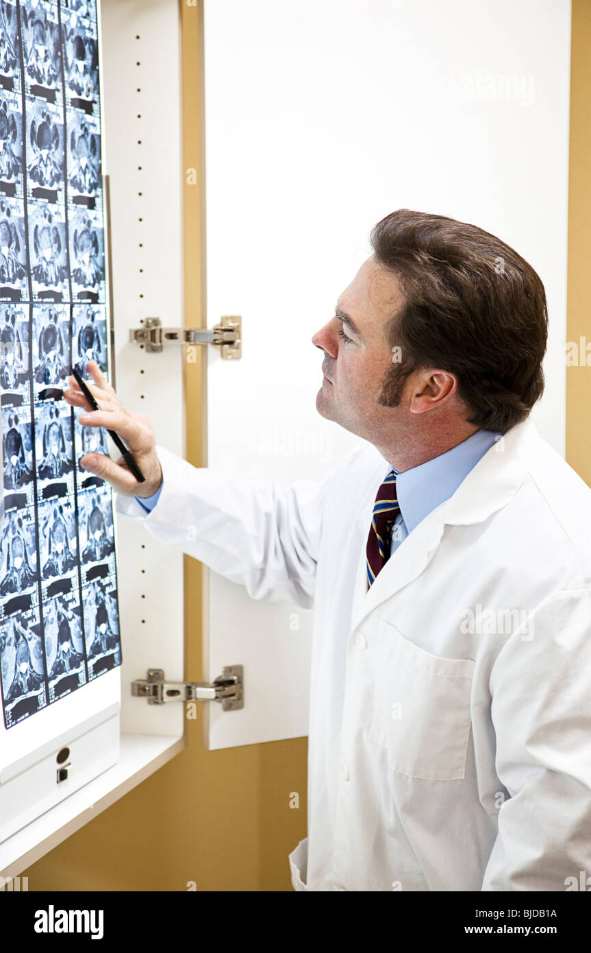 Chiropractic doctor examining a CT scan of the spine Stock Photo - Alamy