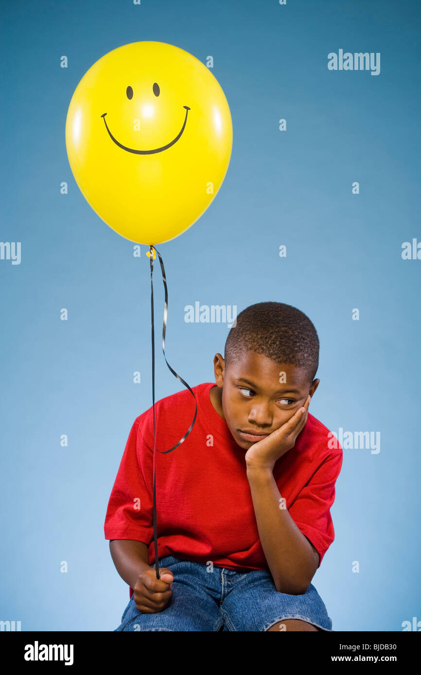 Child holding a balloon Stock Photo - Alamy