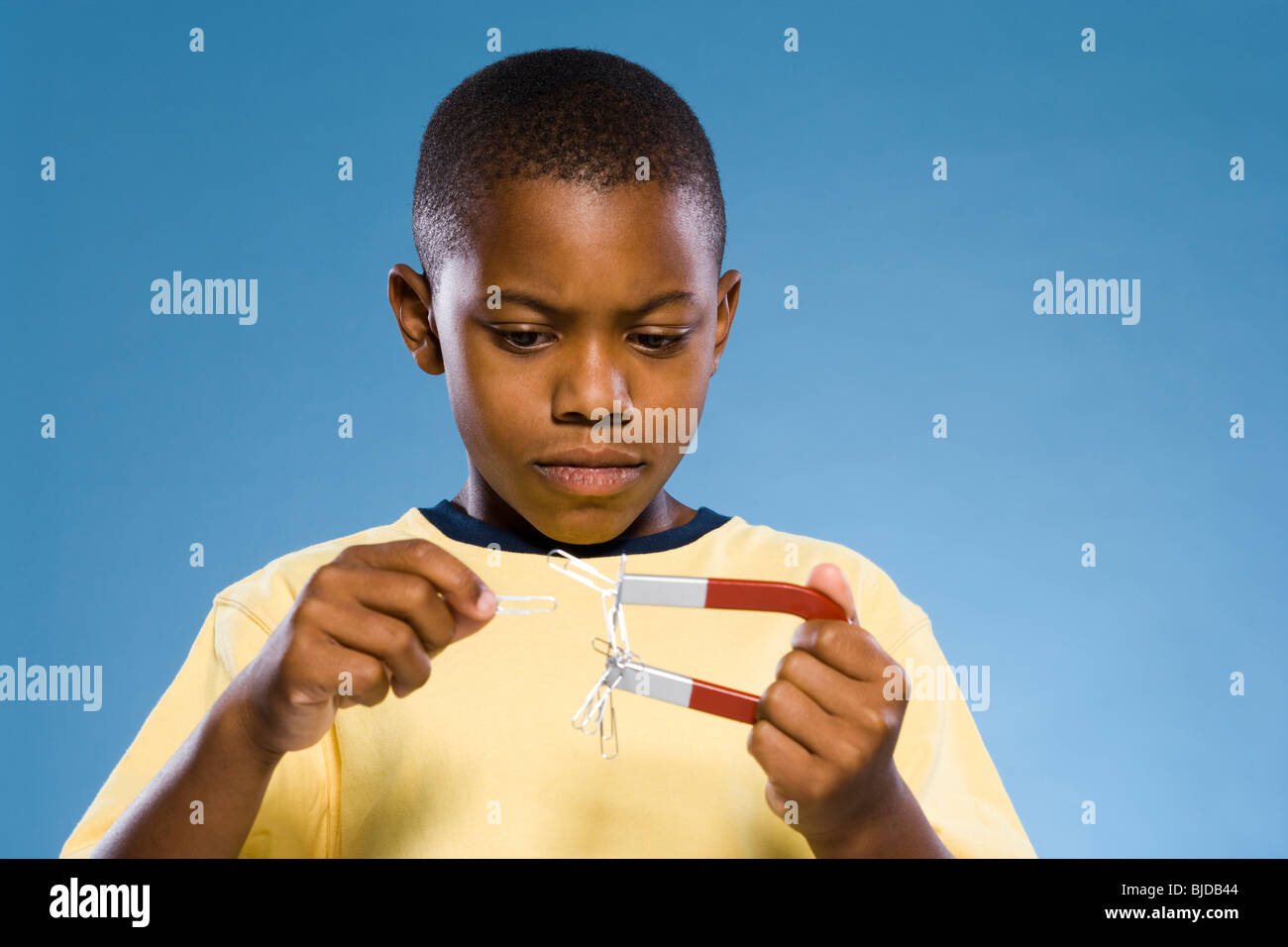 Child holding a magnet Stock Photo - Alamy