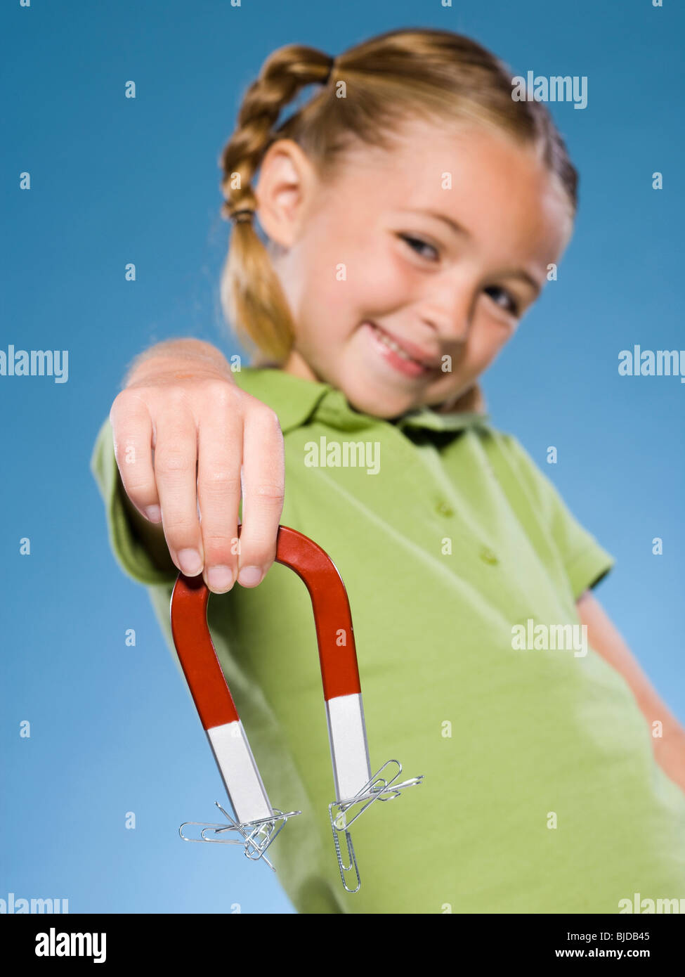Child holding a magnet Stock Photo - Alamy