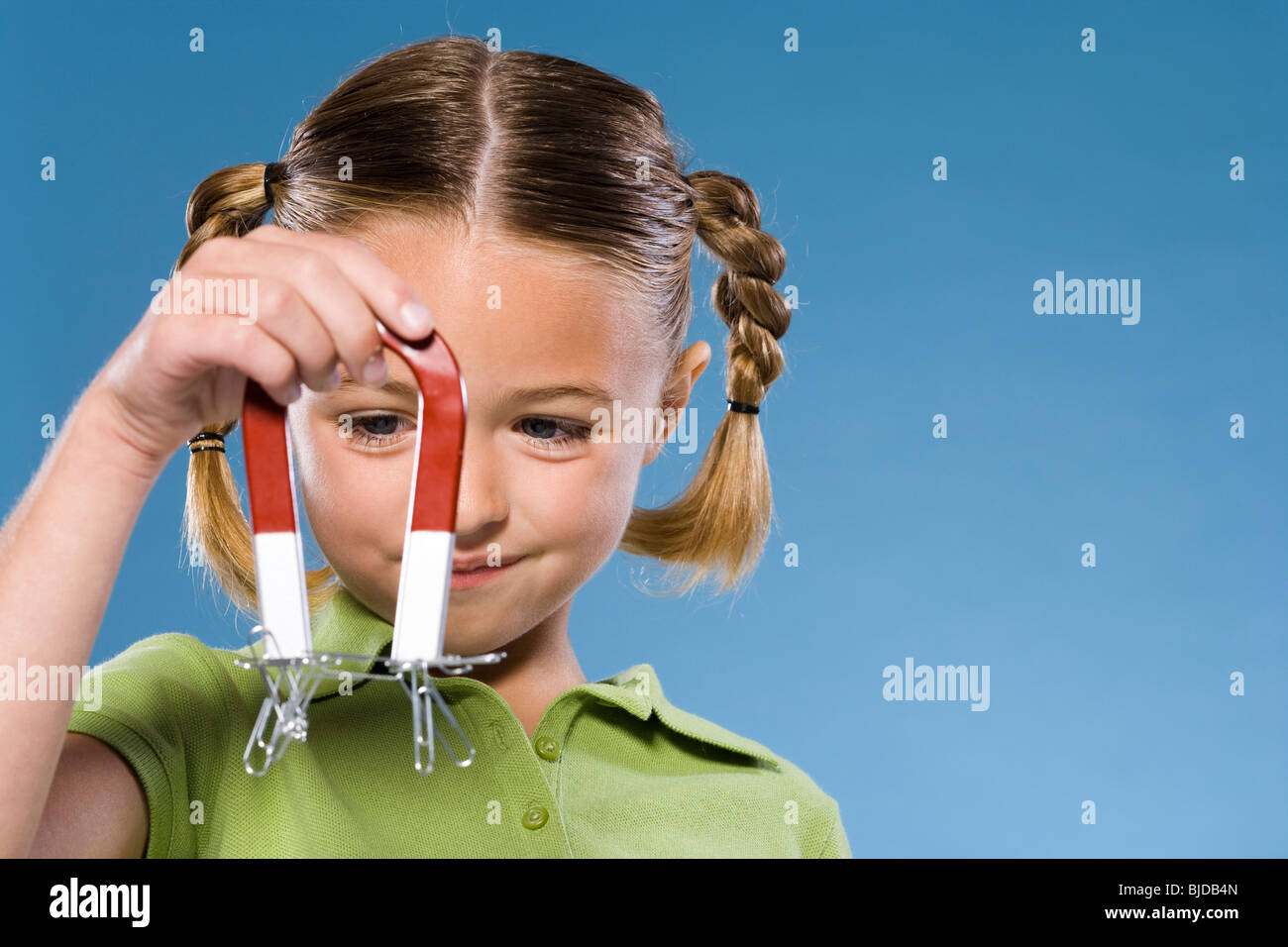 Child holding a magnet Stock Photo - Alamy