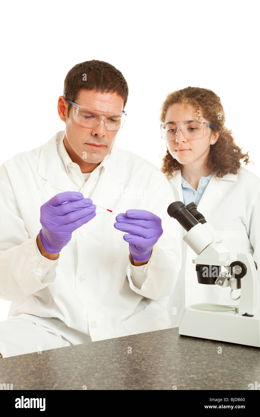 Forensic or medical scientists preparing to analyze a blood sample ...