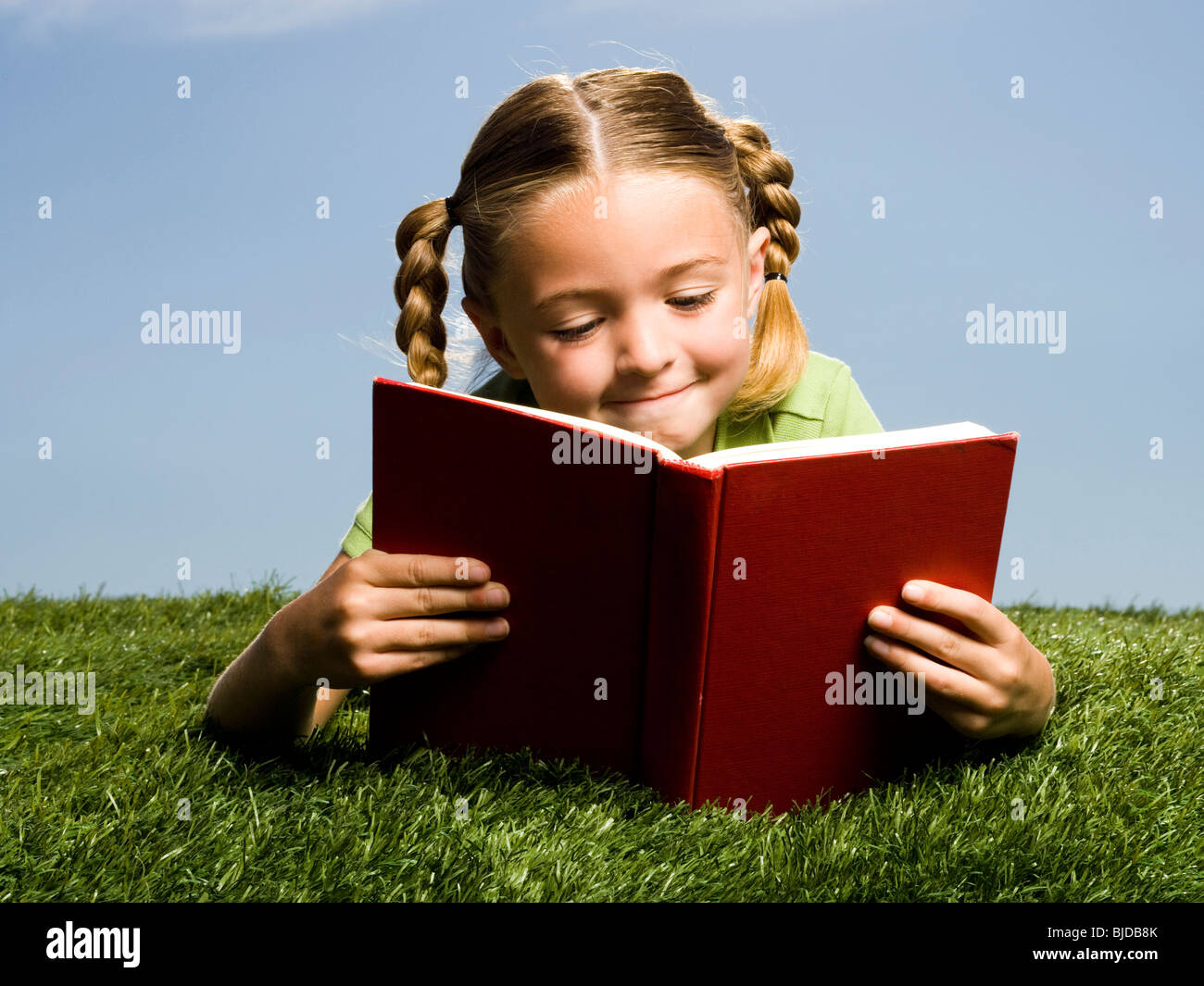 Child reading a book Stock Photo - Alamy