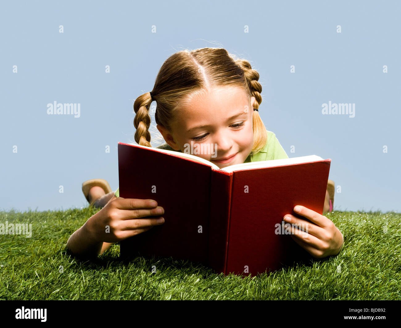 Child reading a book Stock Photo - Alamy