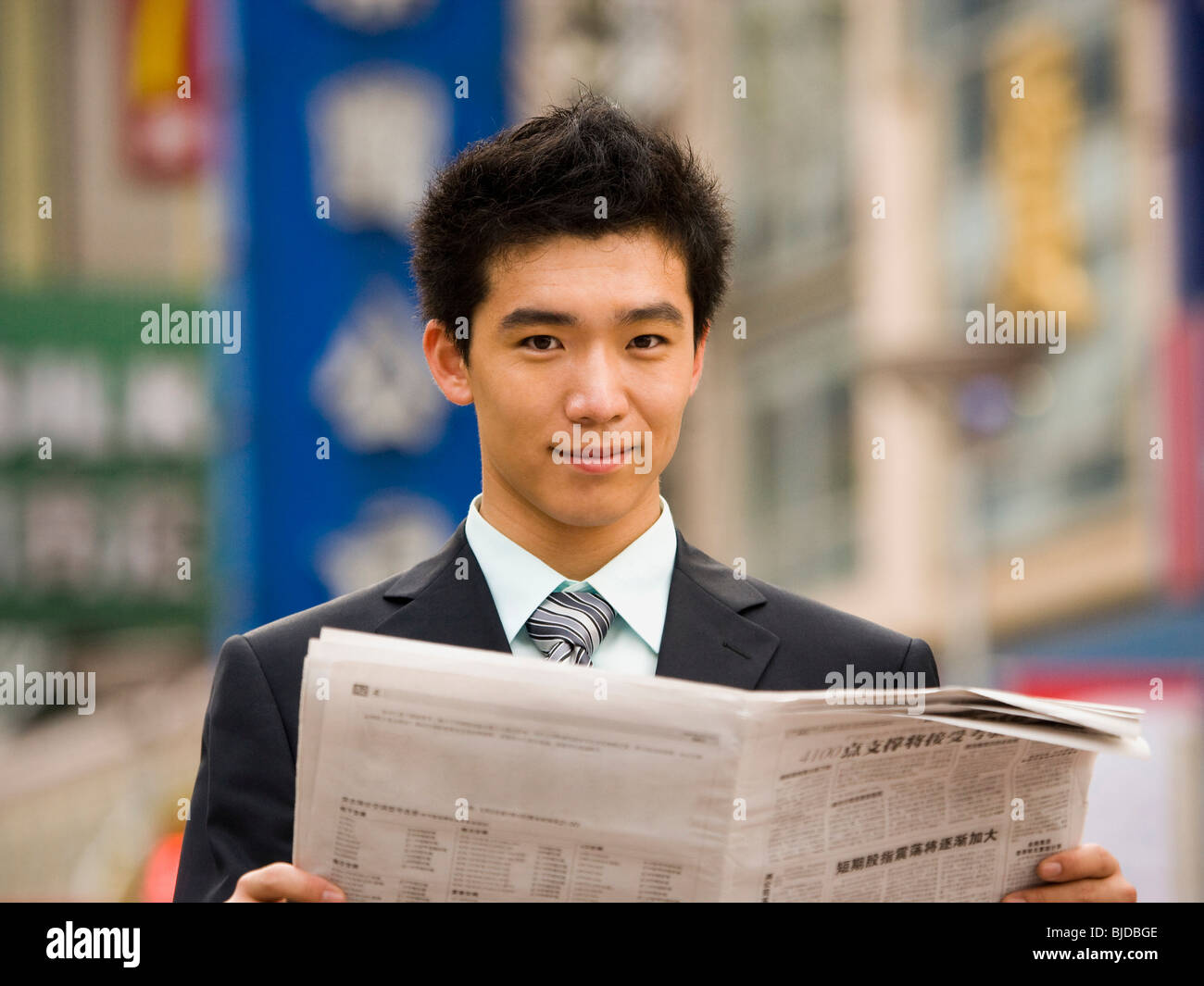 Man reading a newspaper Stock Photo - Alamy