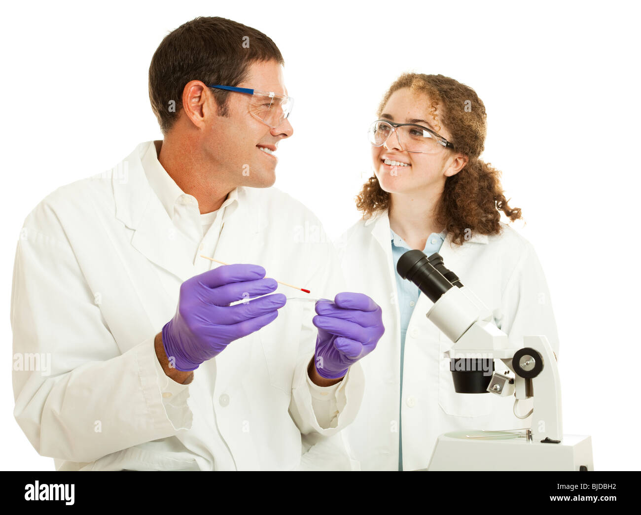Two scientists working together in a laboratory. The younger one could ...
