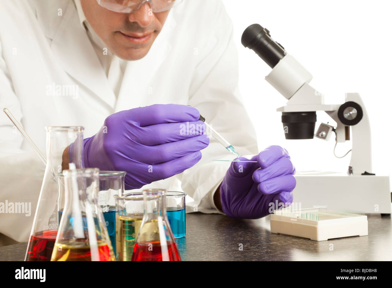 Scientist in his laboratory prepares a slide for the microscope Stock ...