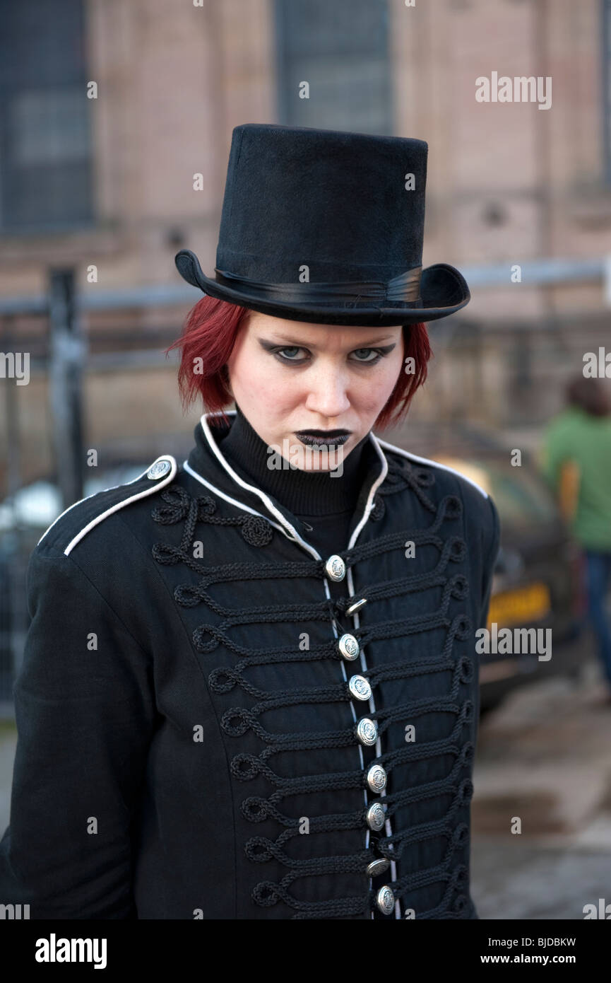 Scary young woman in top hat Stock Photo - Alamy