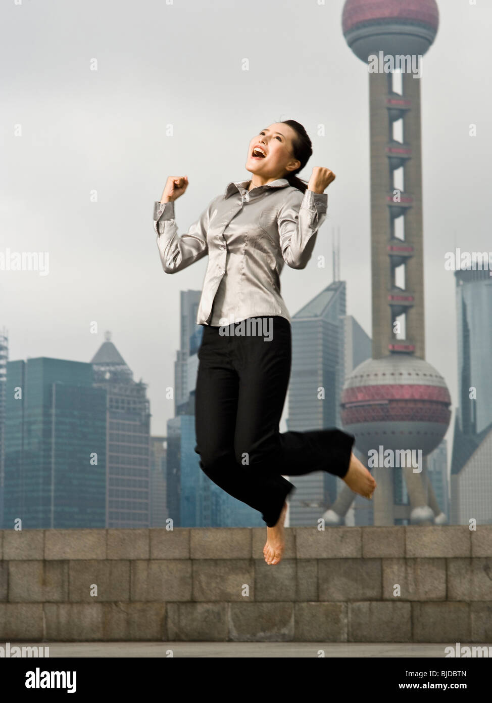 Woman jumping in the air Stock Photo - Alamy