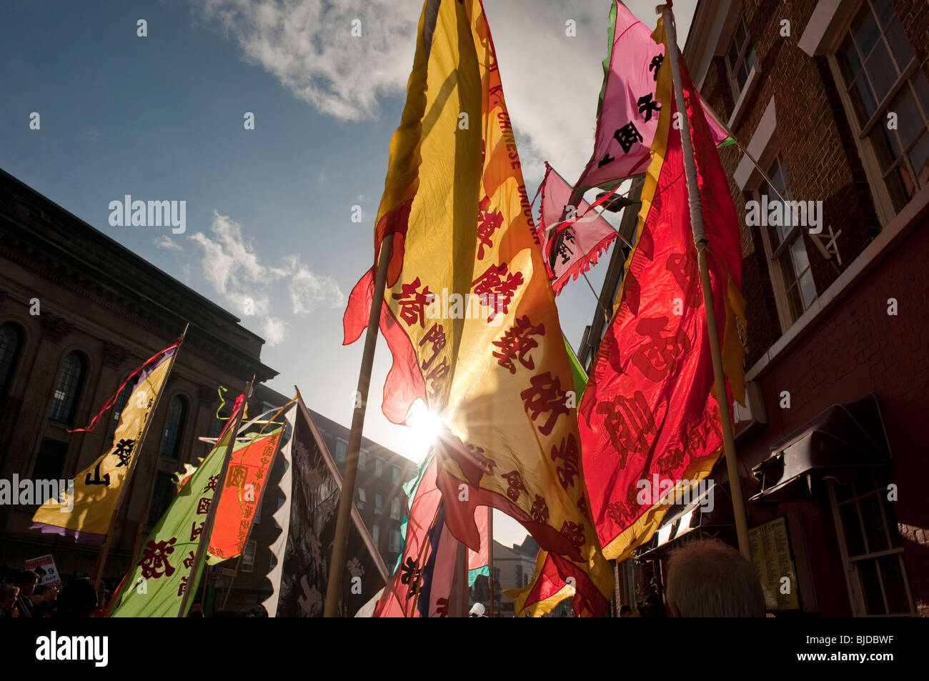 Chinese celebration flags lit by sun at festival Stock Photo - Alamy