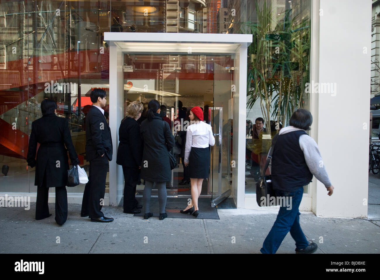 Customers line up outside the new Kyochon Korean Fried Chicken ...