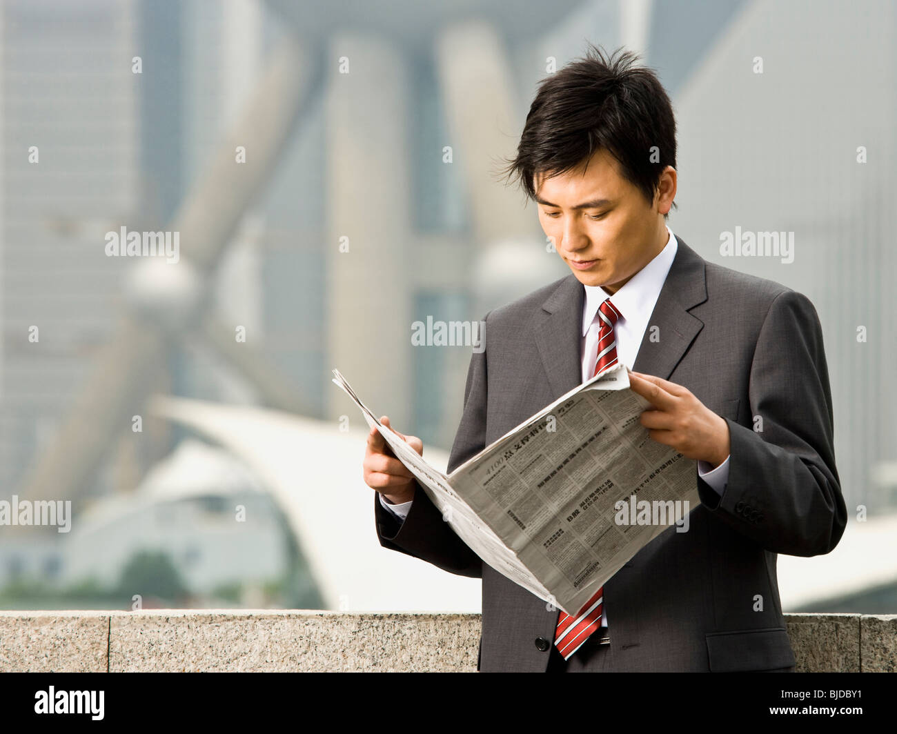 Man reading a newspaper Stock Photo - Alamy