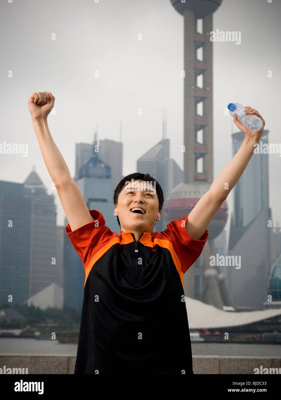 Man raising arms in the air Stock Photo - Alamy