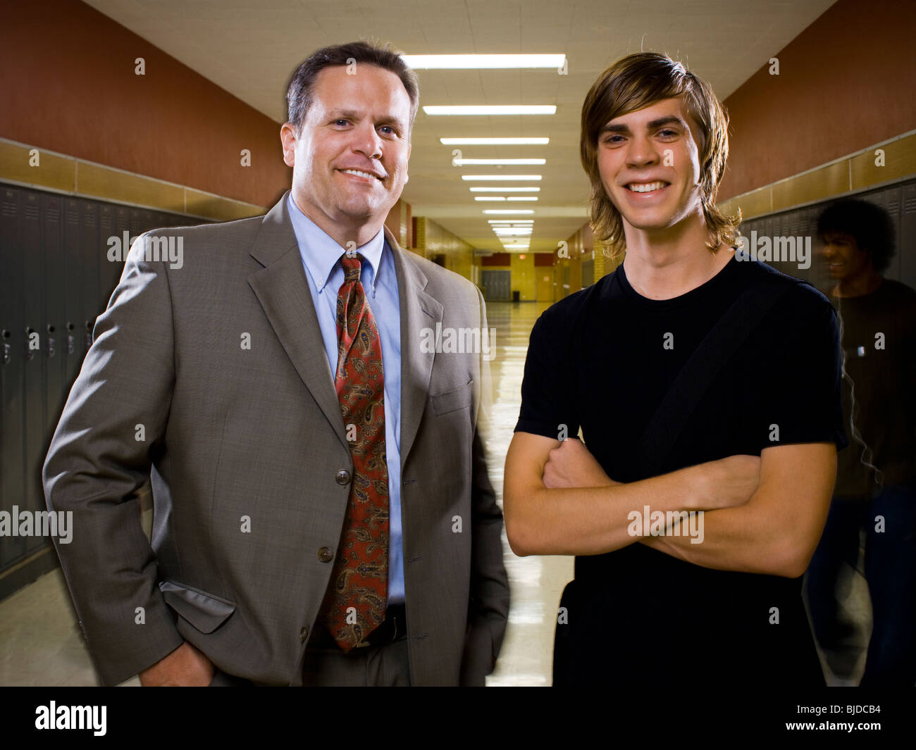 High School Principal stands with a student Stock Photo - Alamy