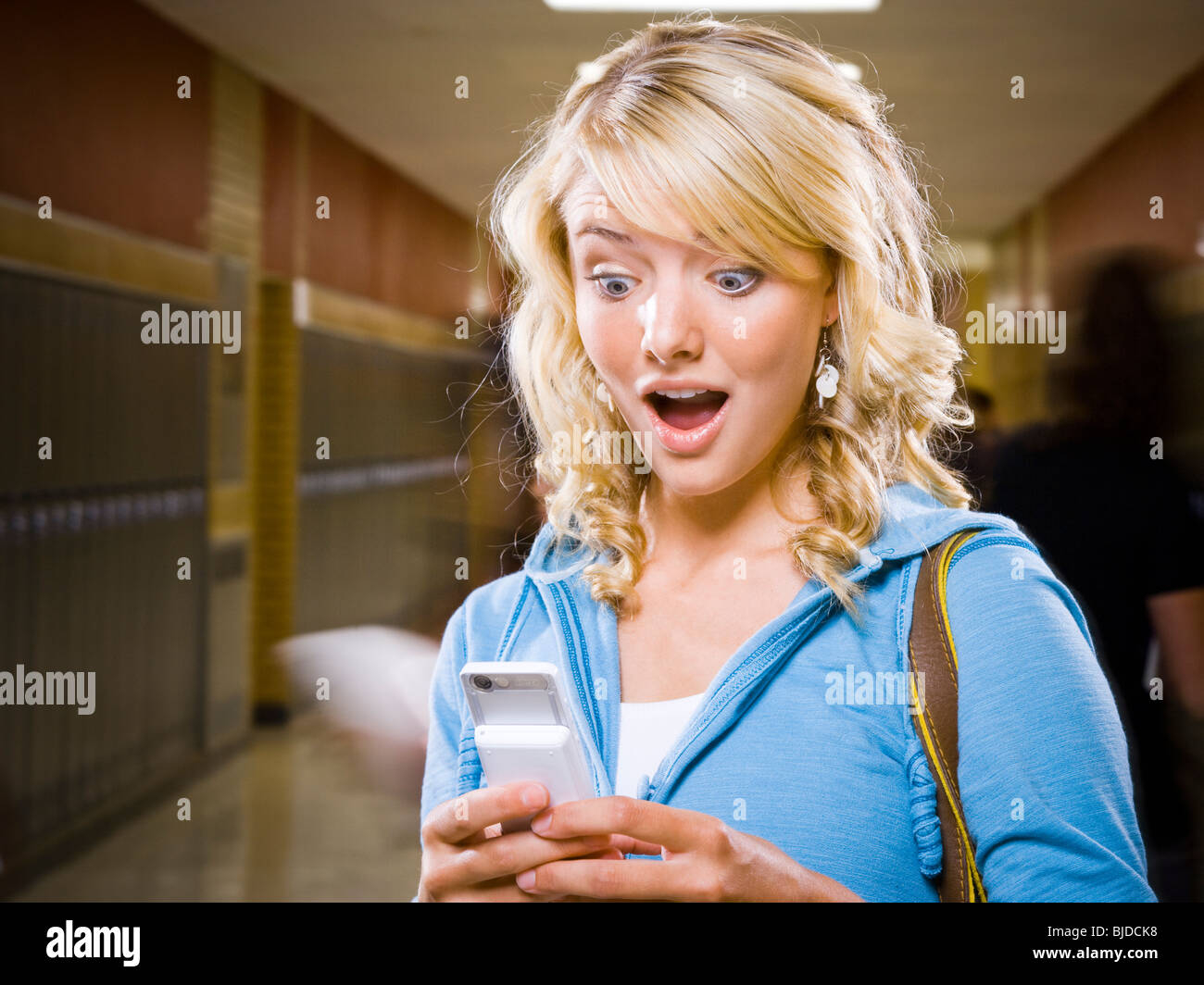 High School girl at school text messaging Stock Photo - Alamy