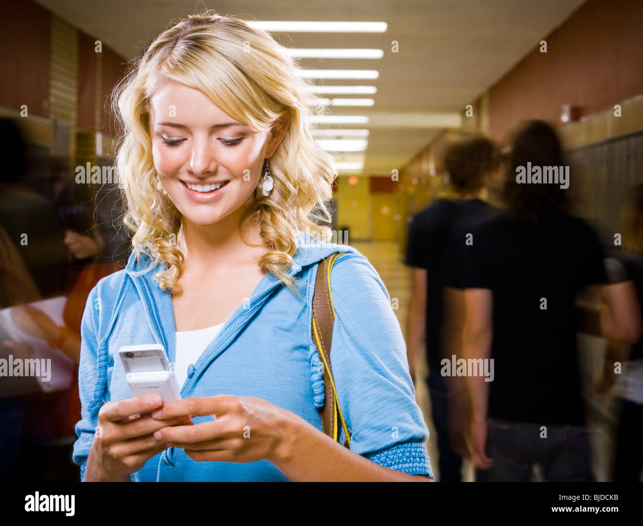 High School girl at school text messaging Stock Photo - Alamy