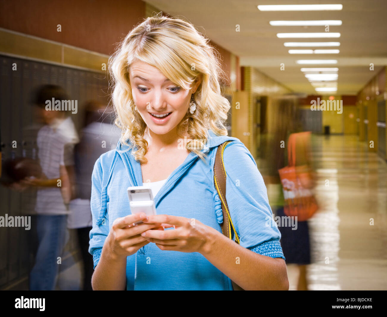High School girl at school text messaging Stock Photo - Alamy
