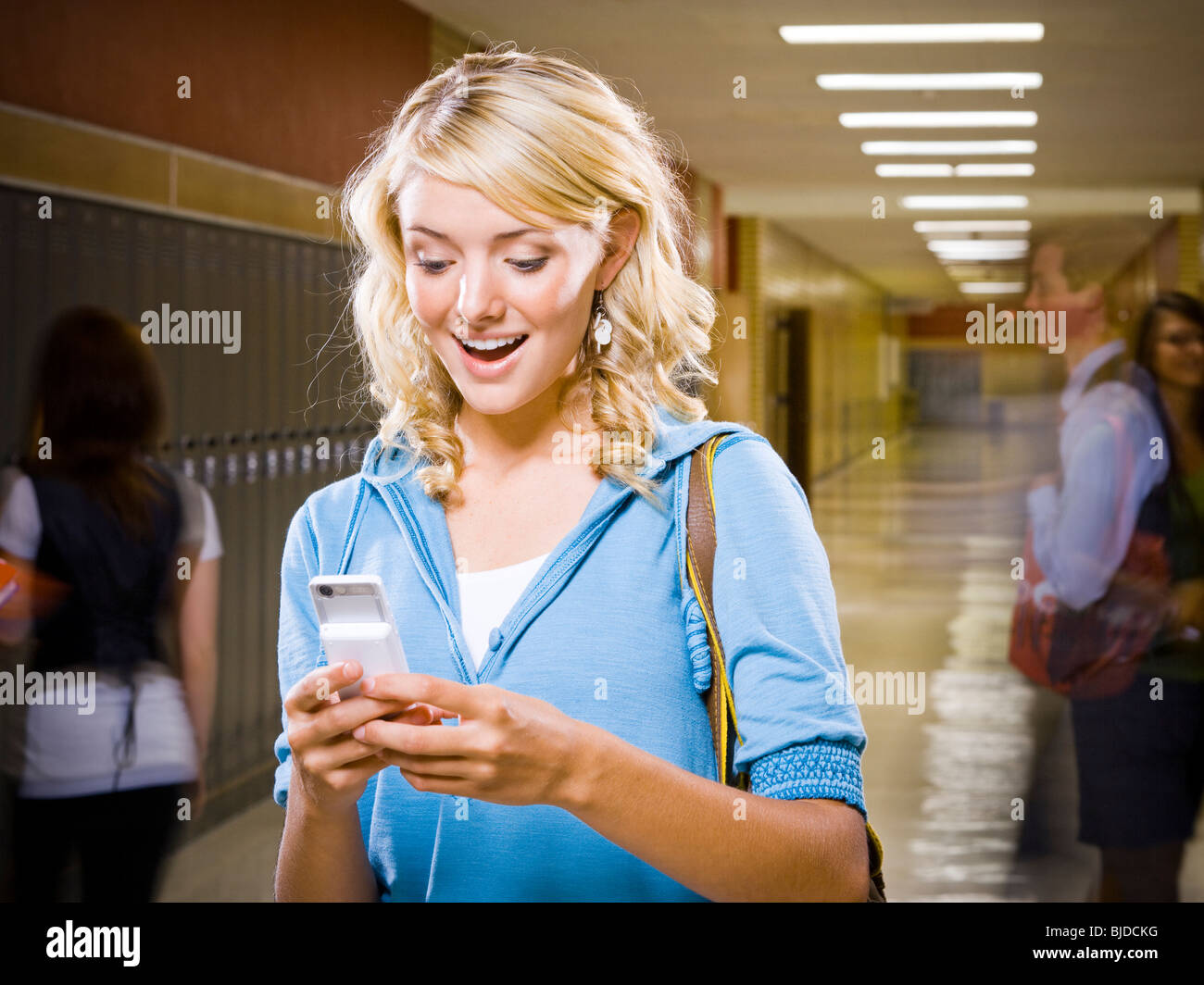 High School girl at school text messaging Stock Photo - Alamy