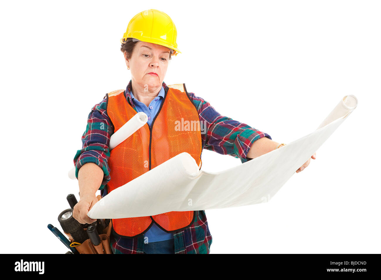 Female construction worker reading blueprints hi-res stock photography ...