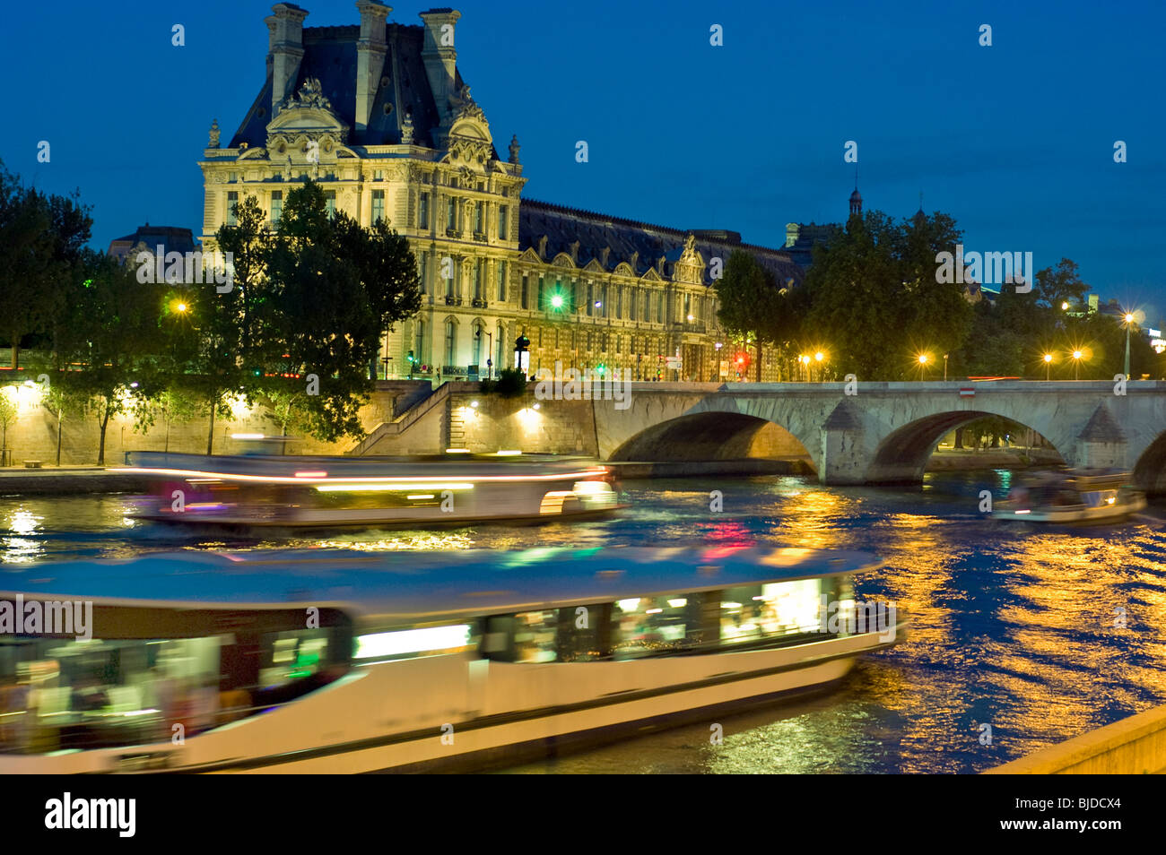 Paris, France - Outside Nighttime View of the Seine River with Louvre ...