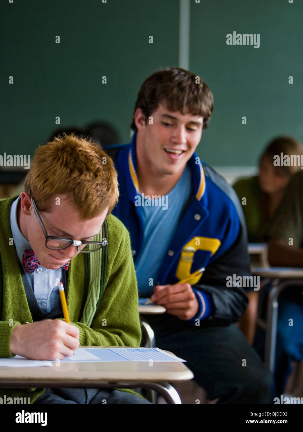 High School cheating off of a Nerd Stock Photo - Alamy
