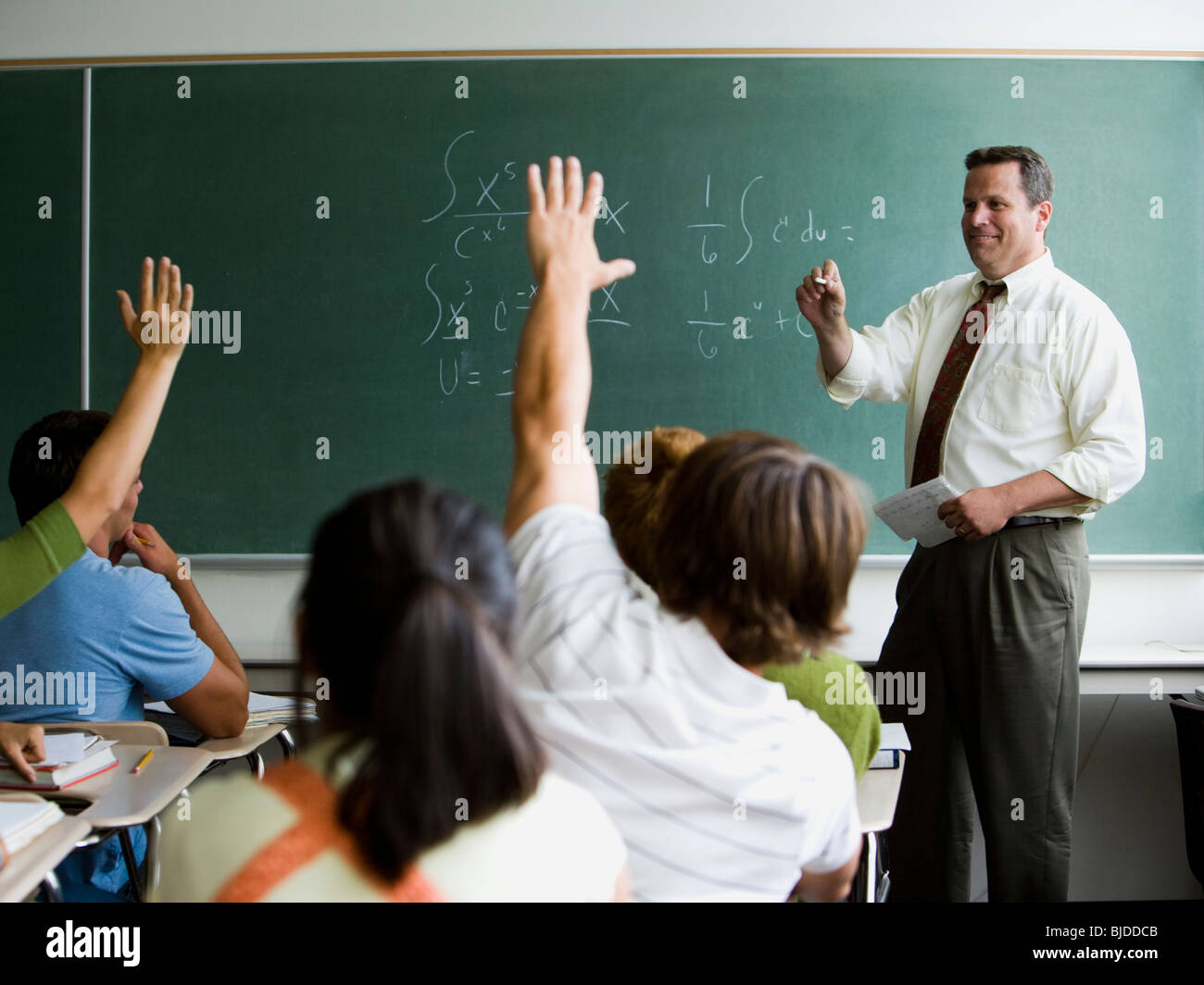 Teacher in a classroom Stock Photo - Alamy