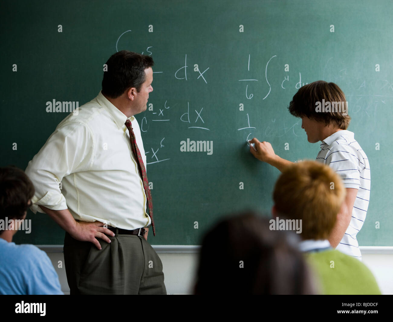 Teacher in a classroom Stock Photo - Alamy