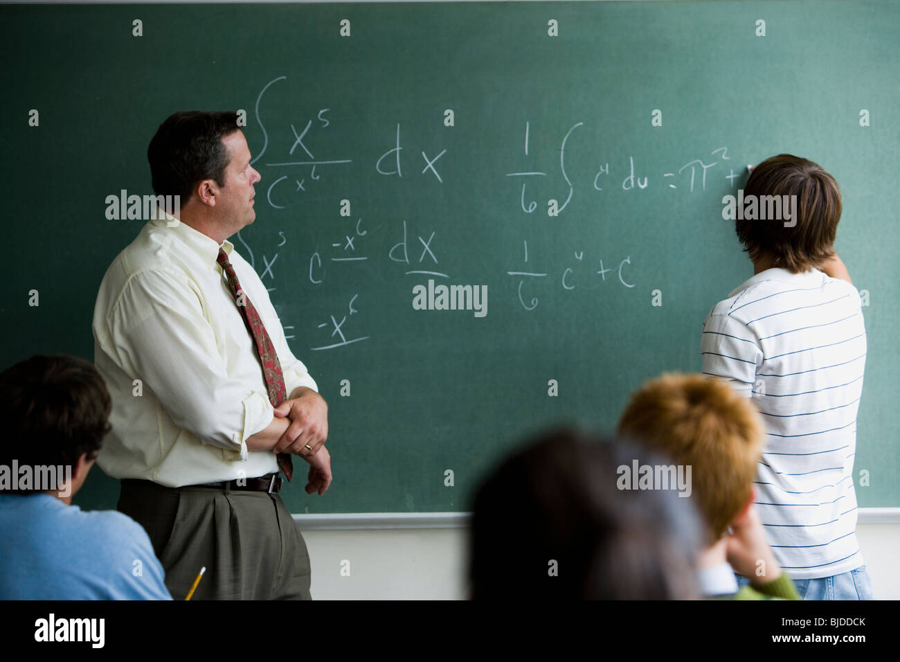 Teacher in a classroom Stock Photo - Alamy