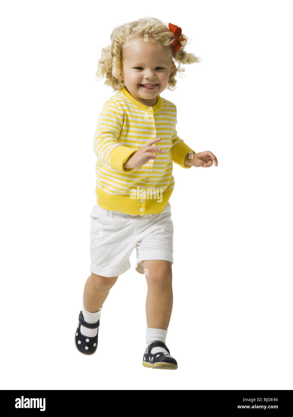 Young girl in a yellow sweater Stock Photo - Alamy