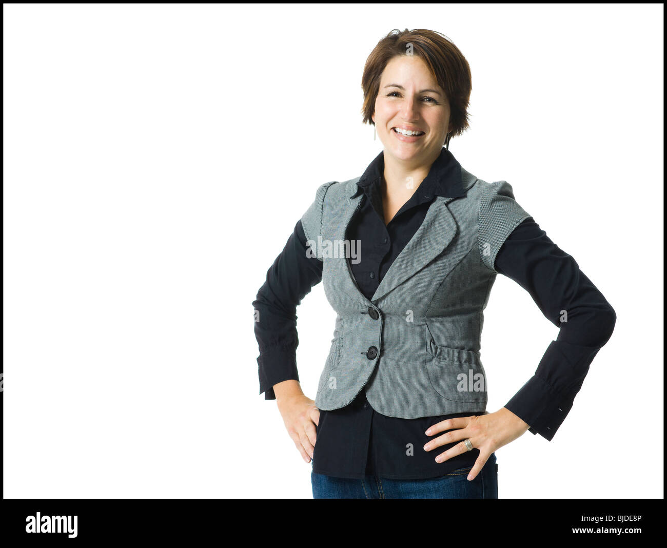 Woman standing with arms folded Stock Photo - Alamy