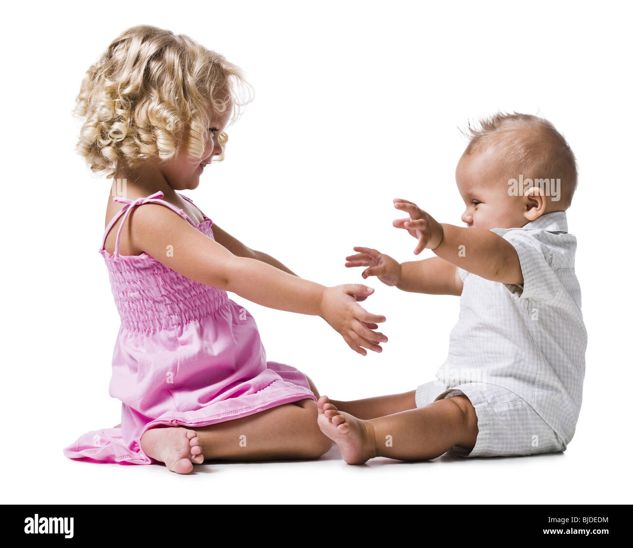 Toddler girl and baby boy Stock Photo - Alamy