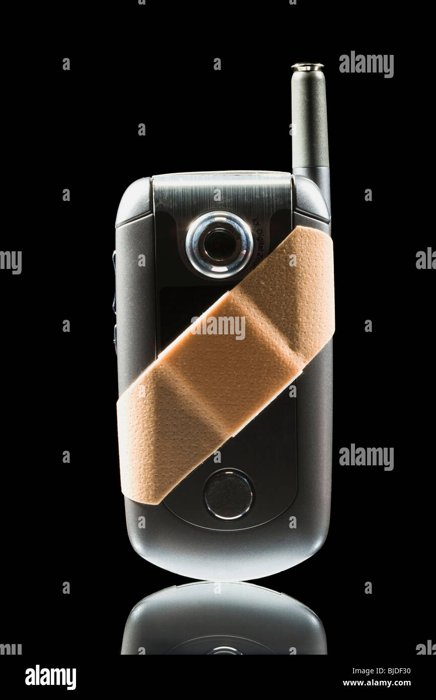 Cell phone band aid on hi-res stock photography and images - Alamy