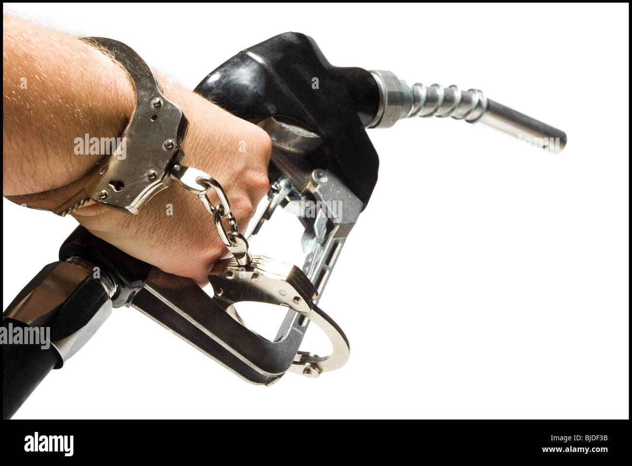 Hand handcuffed to a gas pump Stock Photo - Alamy