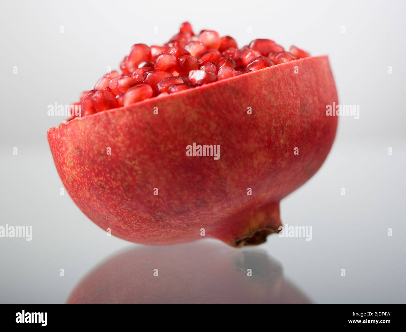 Half of a pomegranate Stock Photo - Alamy