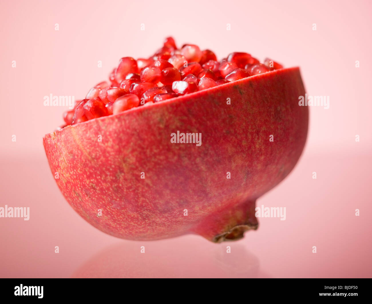 Half of a pomegranate Stock Photo - Alamy