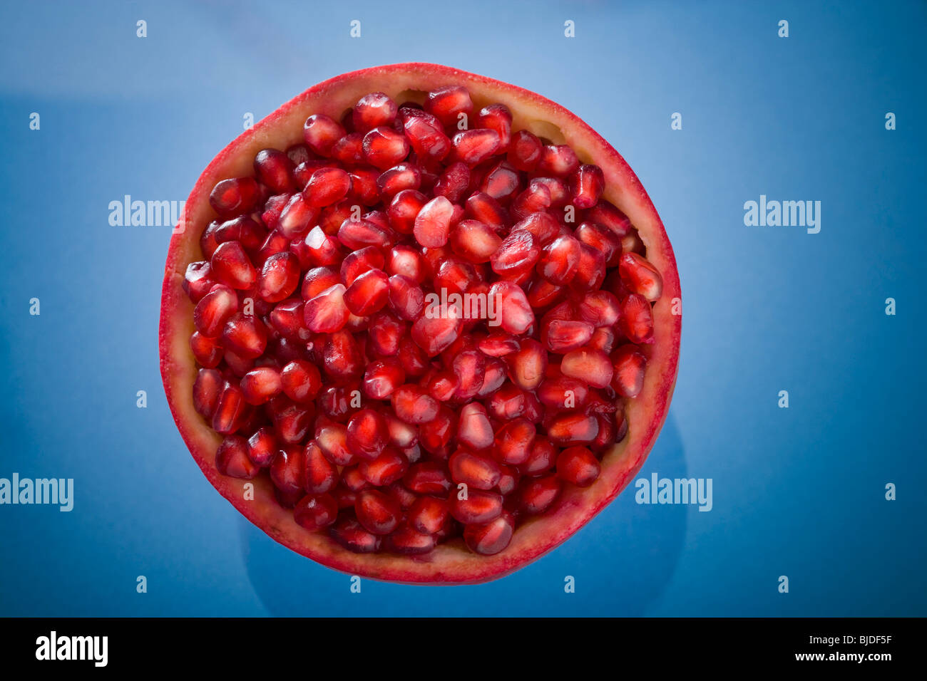 Half of a pomegranate Stock Photo - Alamy