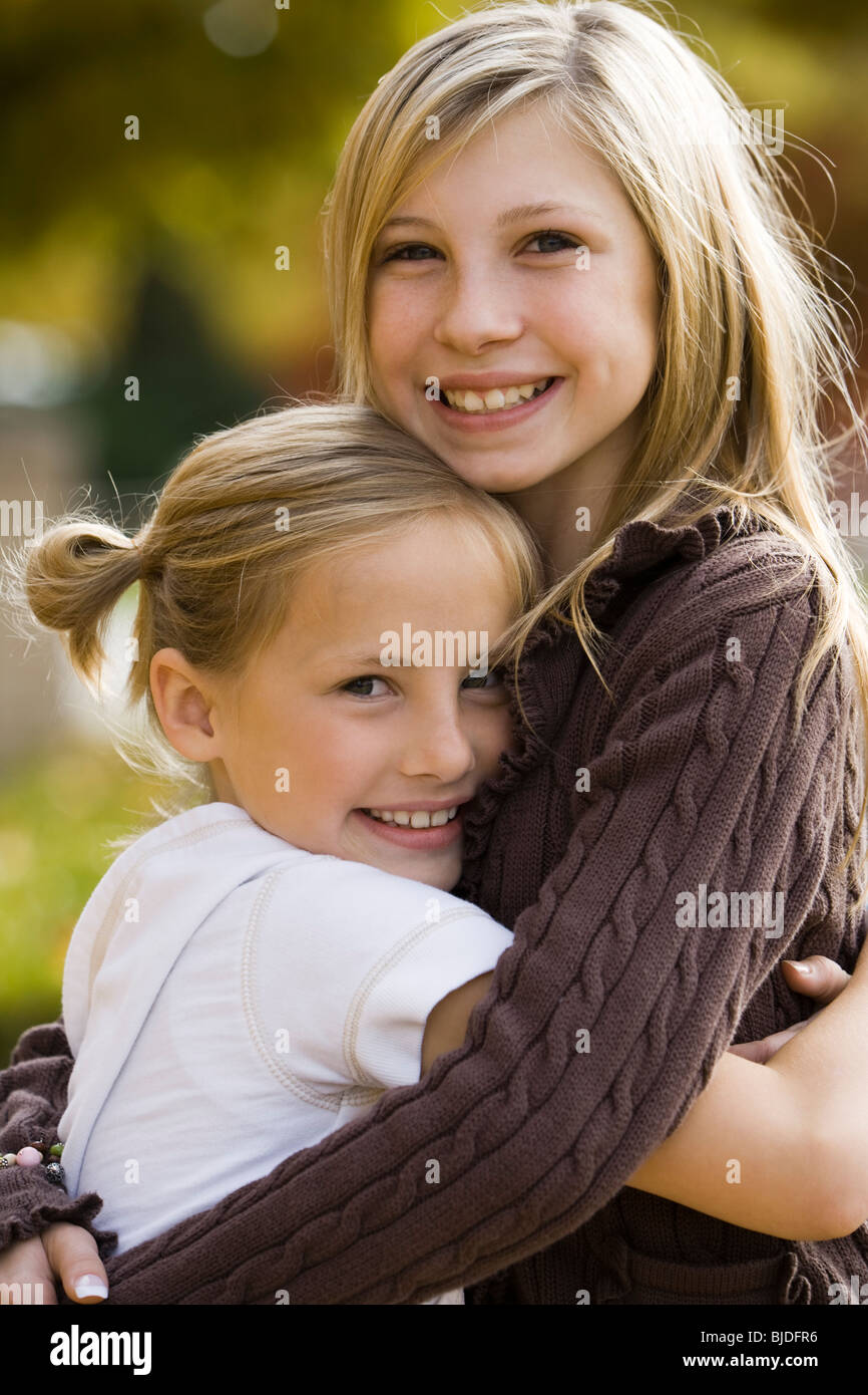 two girls hugging Stock Photo - Alamy