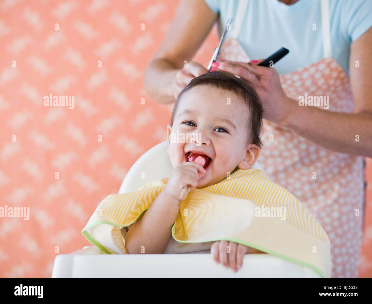 Baby getting a haircut Stock Photo - Alamy