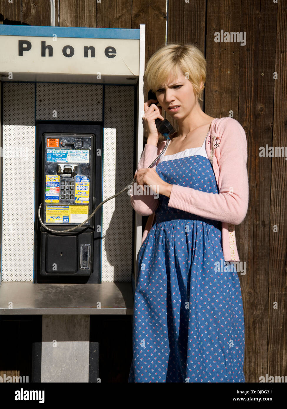 woman using a pay phone Stock Photo - Alamy