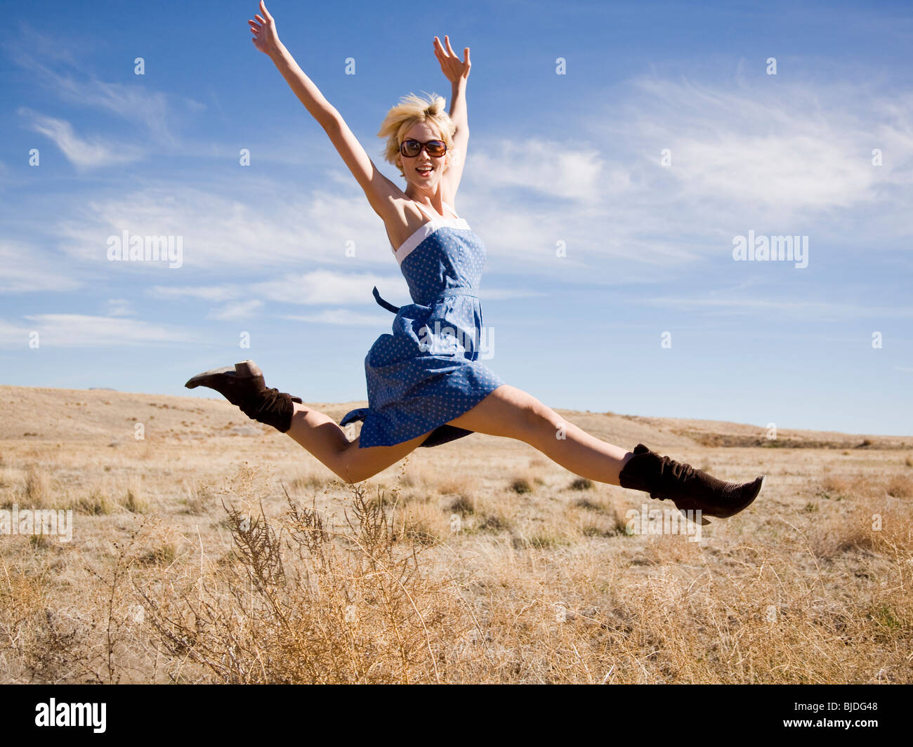 Leaping woman dress hi-res stock photography and images - Alamy